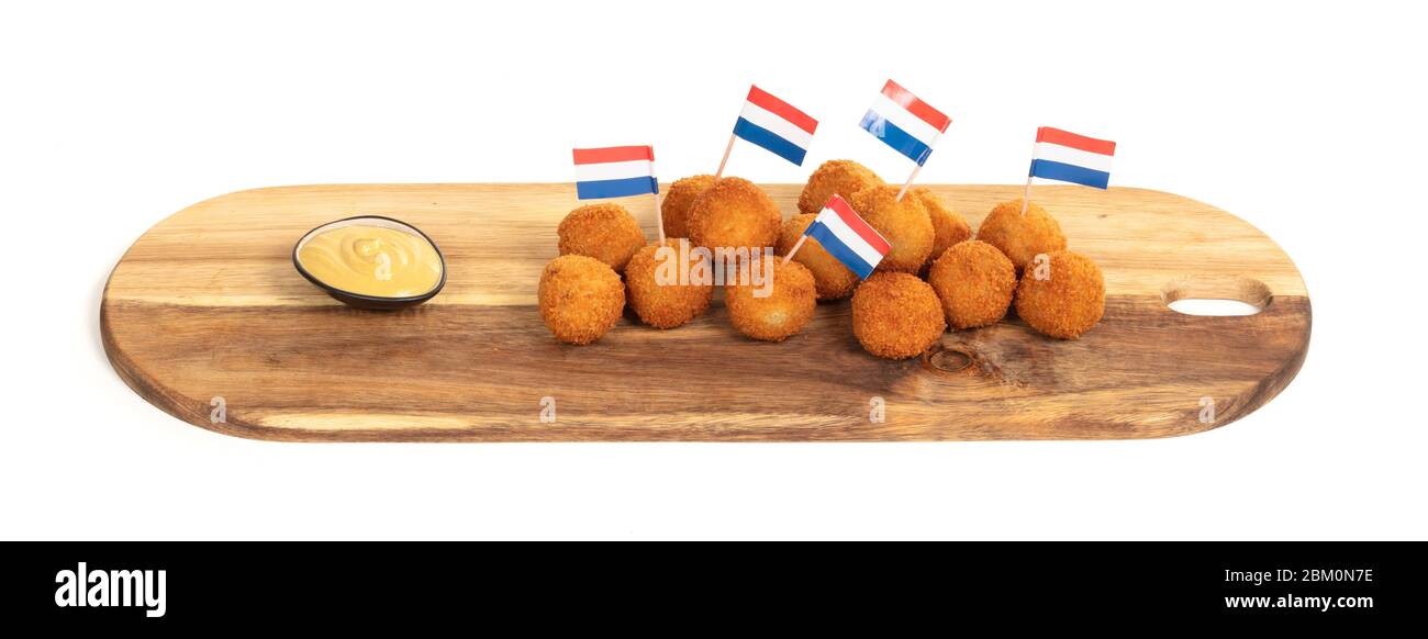 Dutch traditional snack bitterbal on a serving board, dutch flag ...