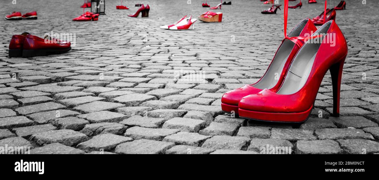 Red shoes to stop violence against women on a city square Stock Photo ...