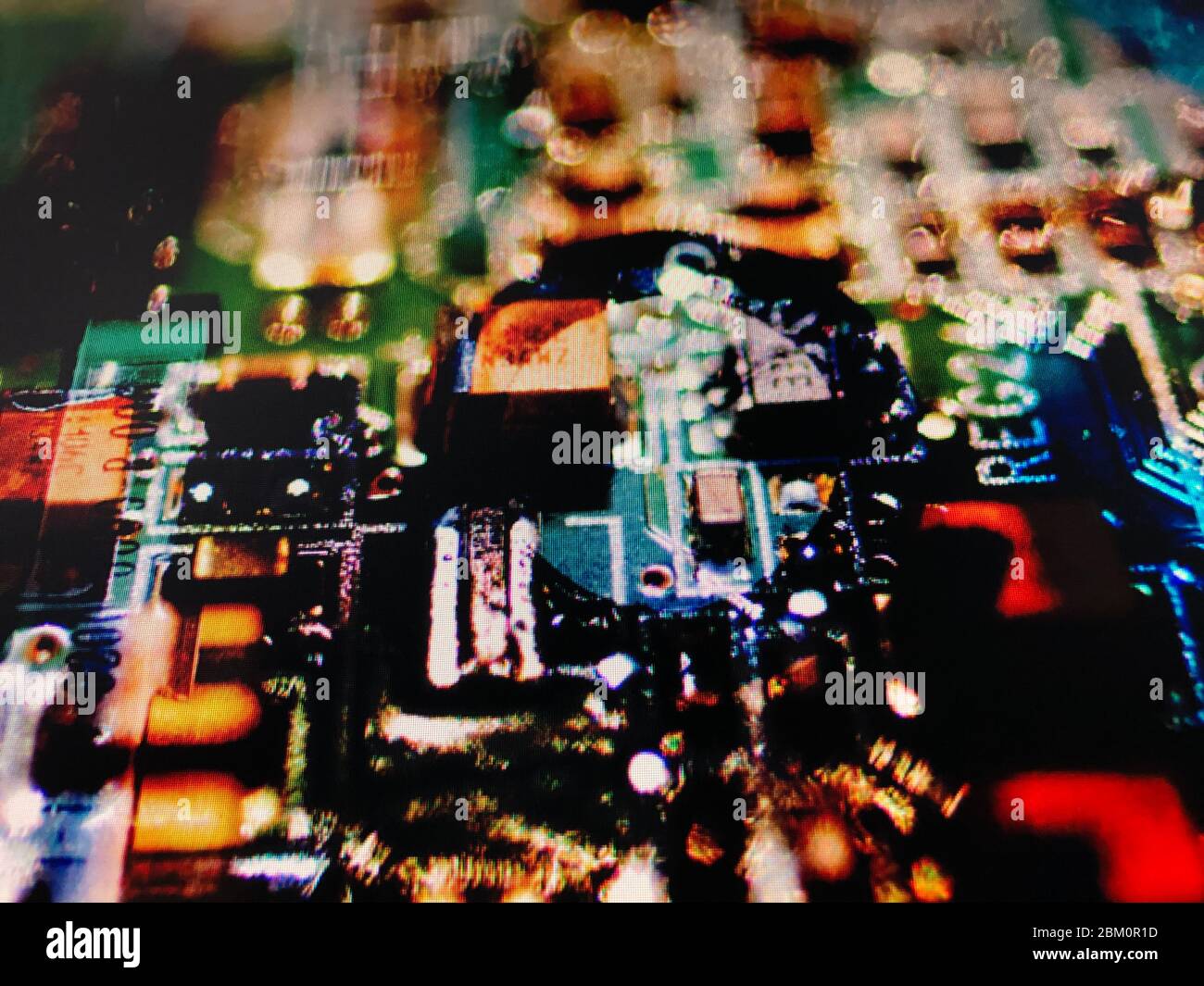 Closeup details of computer circuit board with experimental treatment ...