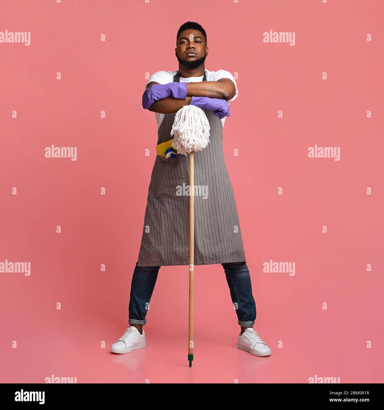 Professional African American Cleaner Posing With Mop Over Pink ...