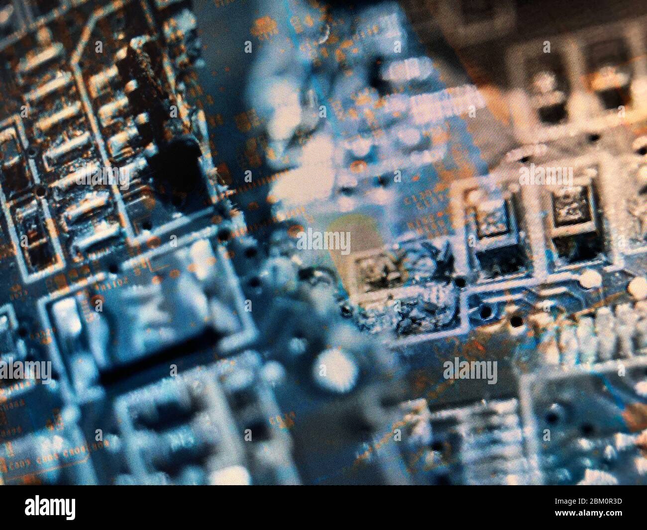 Closeup details of computer circuit board with experimental treatment ...
