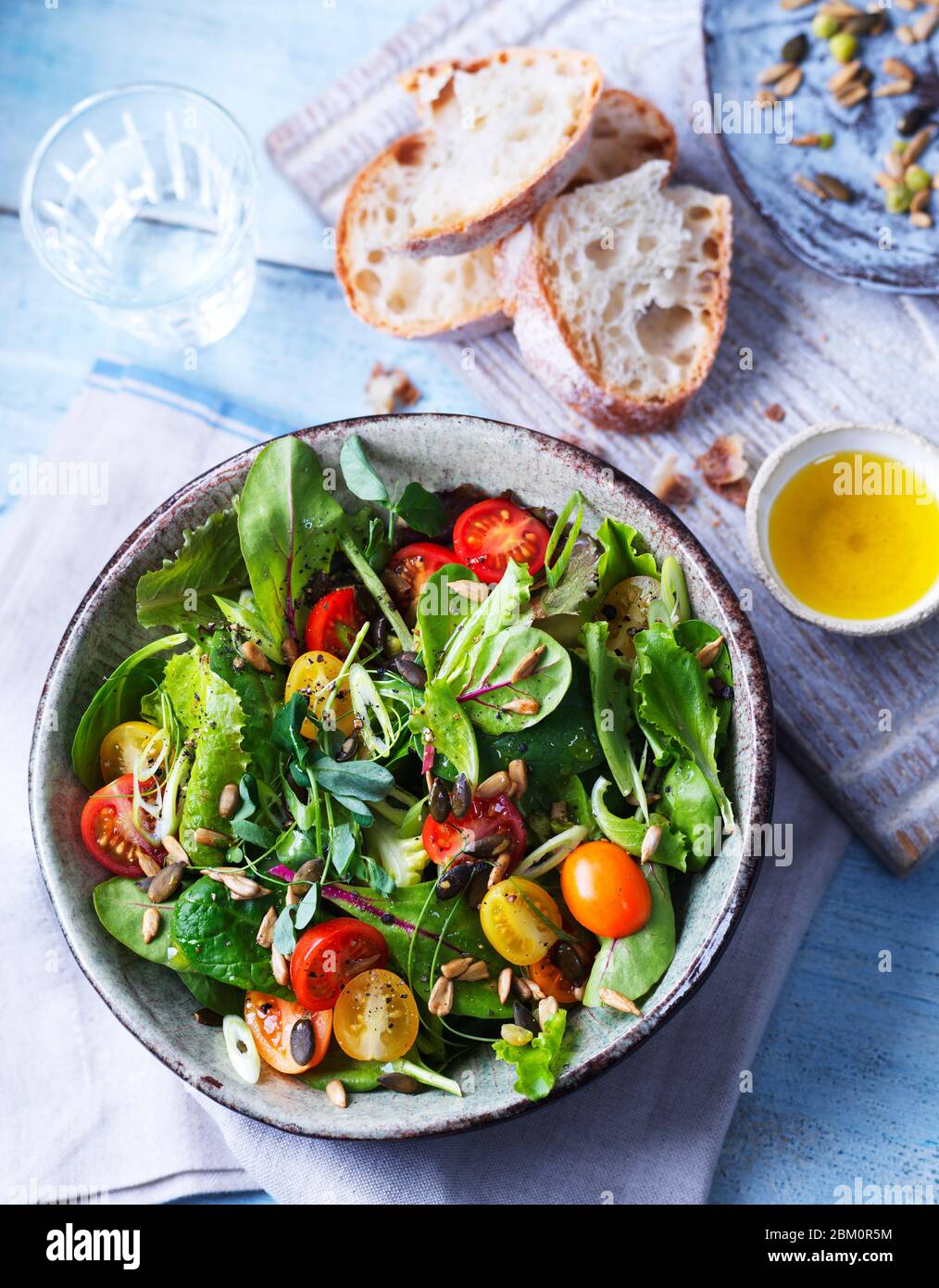 Fresh Colourful Salad with cherry tomatoes, seeds, spring onions, salad ...
