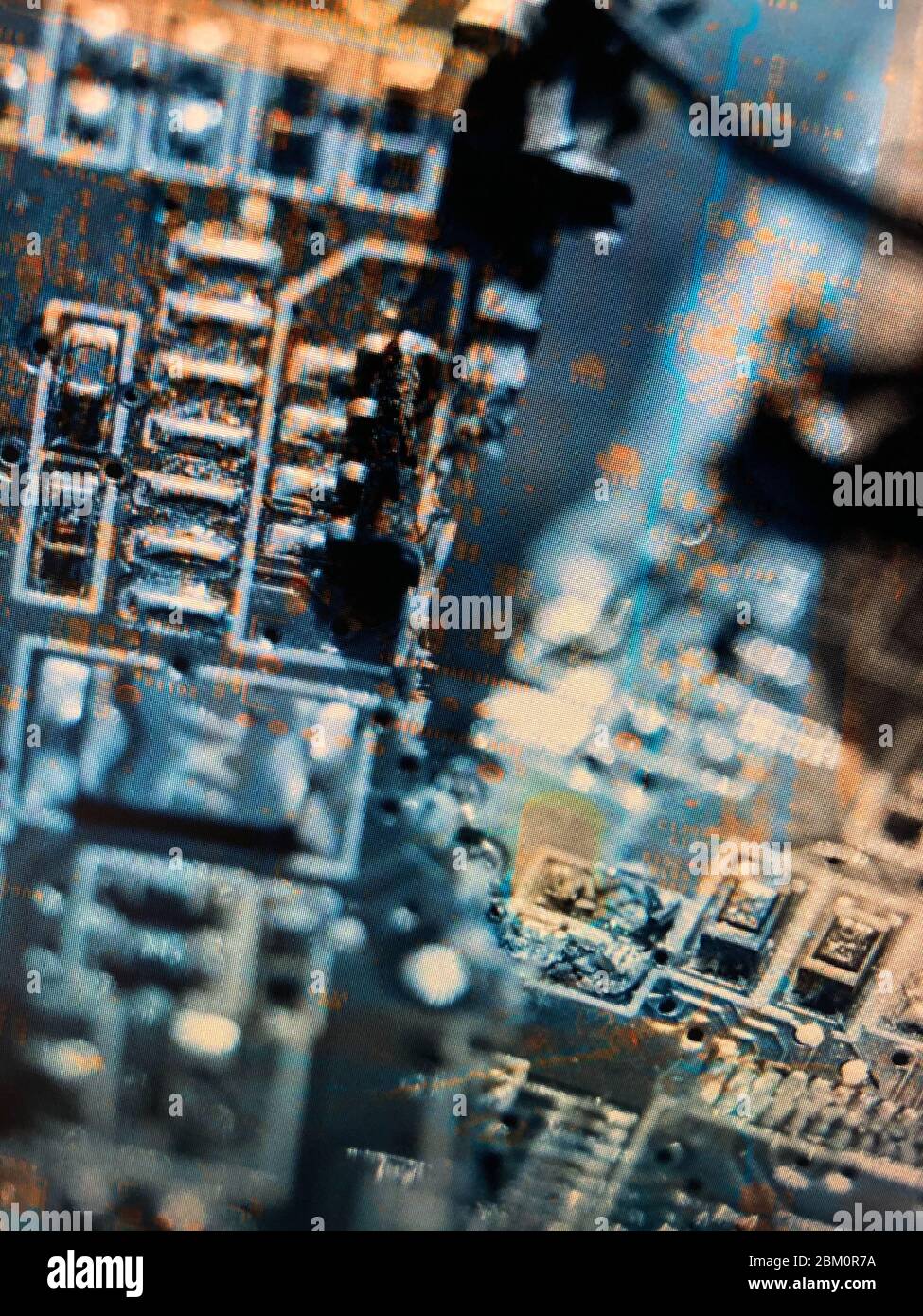 Closeup details of computer circuit board with experimental treatment ...