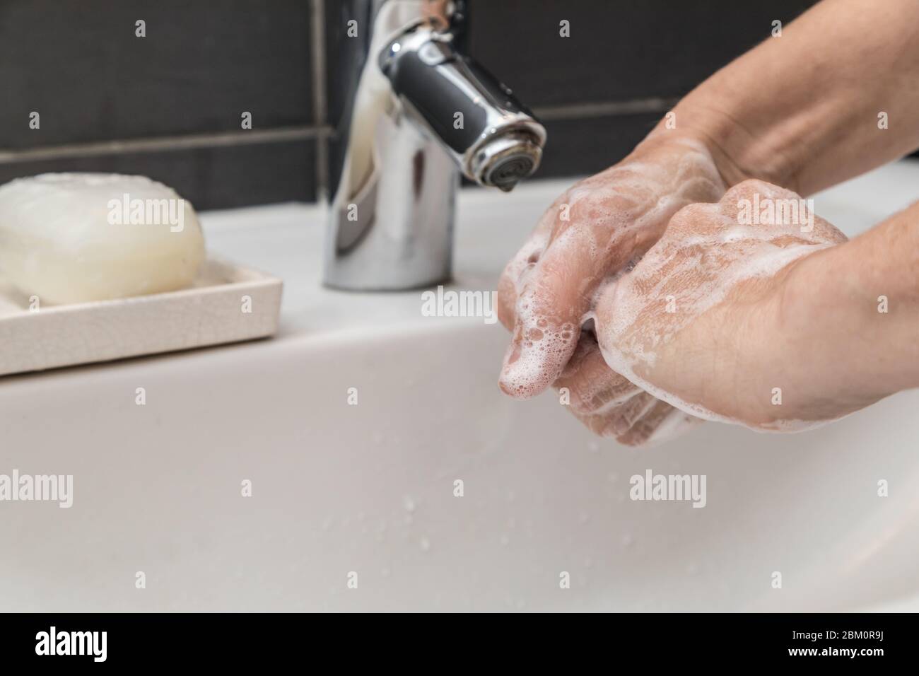 Washing hands with soap hi-res stock photography and images - Alamy