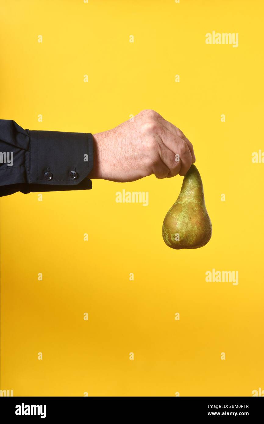 Man hand holding pear hi-res stock photography and images - Alamy