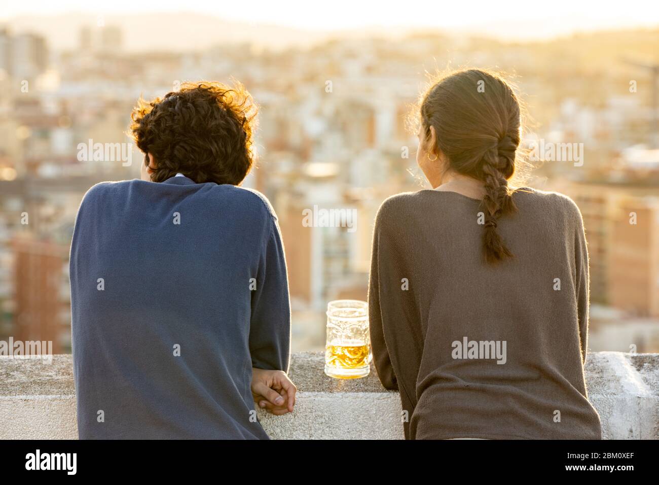 Two people on balcony behind hi-res stock photography and images - Alamy