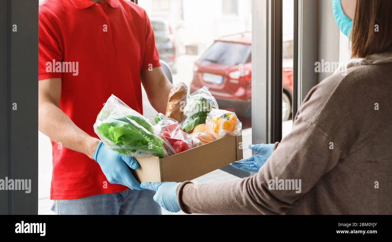 Courier deliver products at home to customer Stock Photo - Alamy