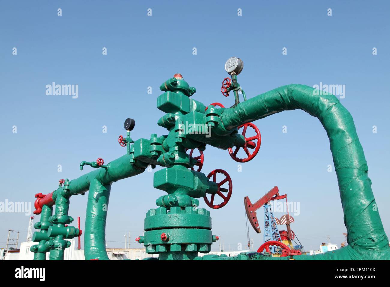 Piping and valves of oil field, close-up Stock Photo - Alamy