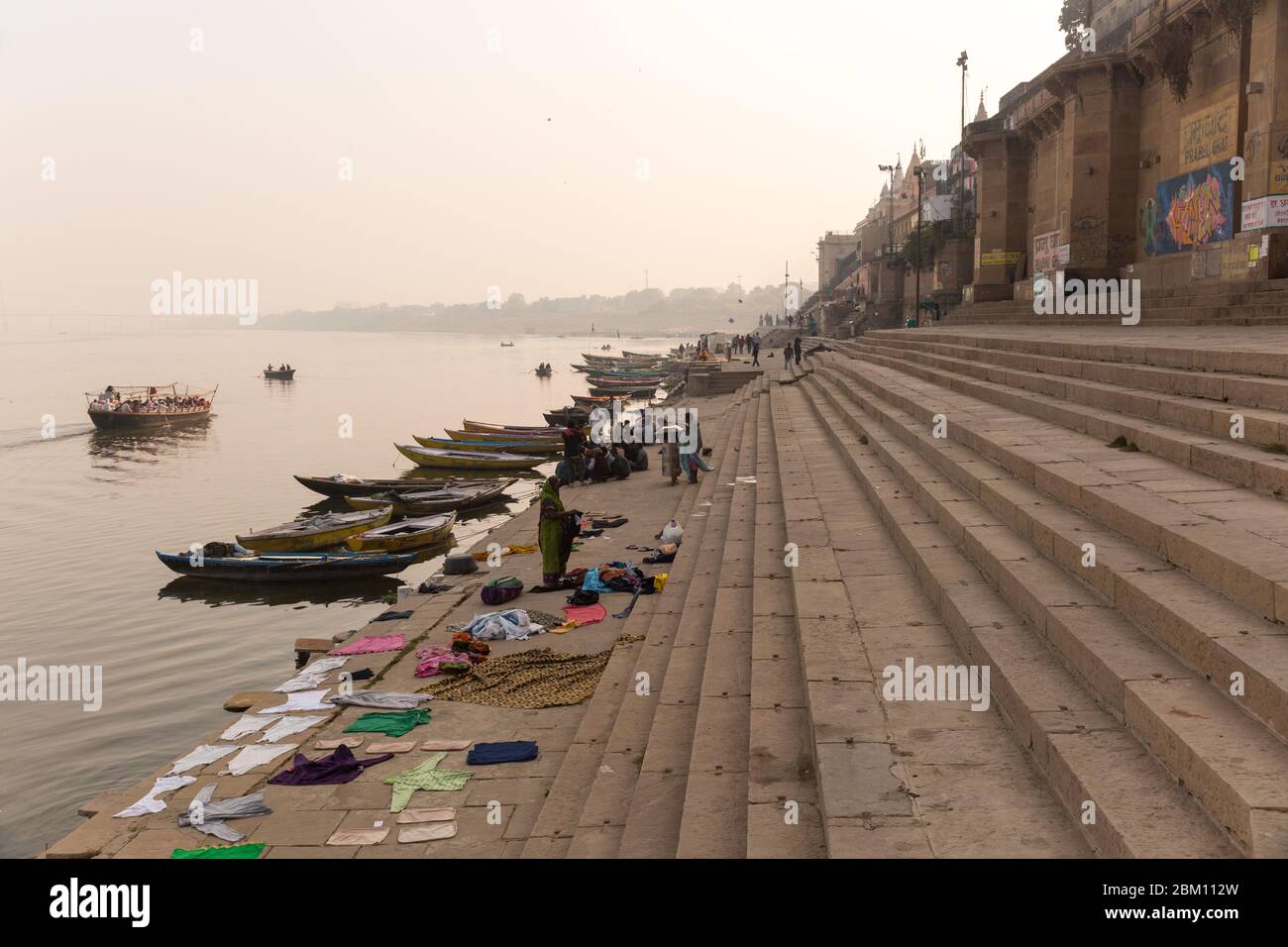 People drying vibrant, colourful Laundry on the Ghats of the Ganges in ...