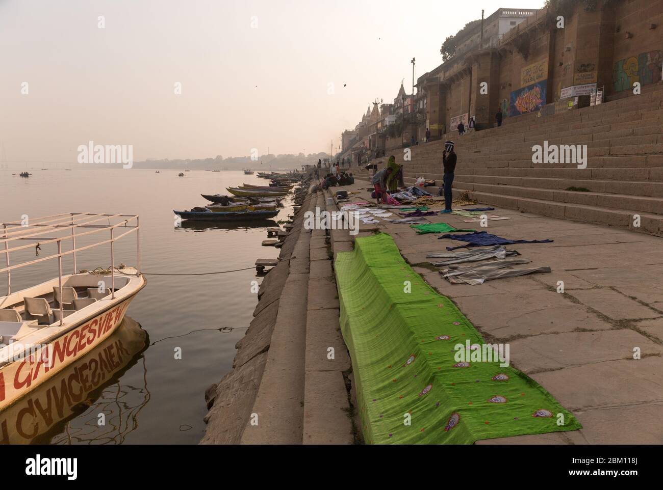 People drying vibrant, colourful Laundry on the Ghats of the Ganges in ...