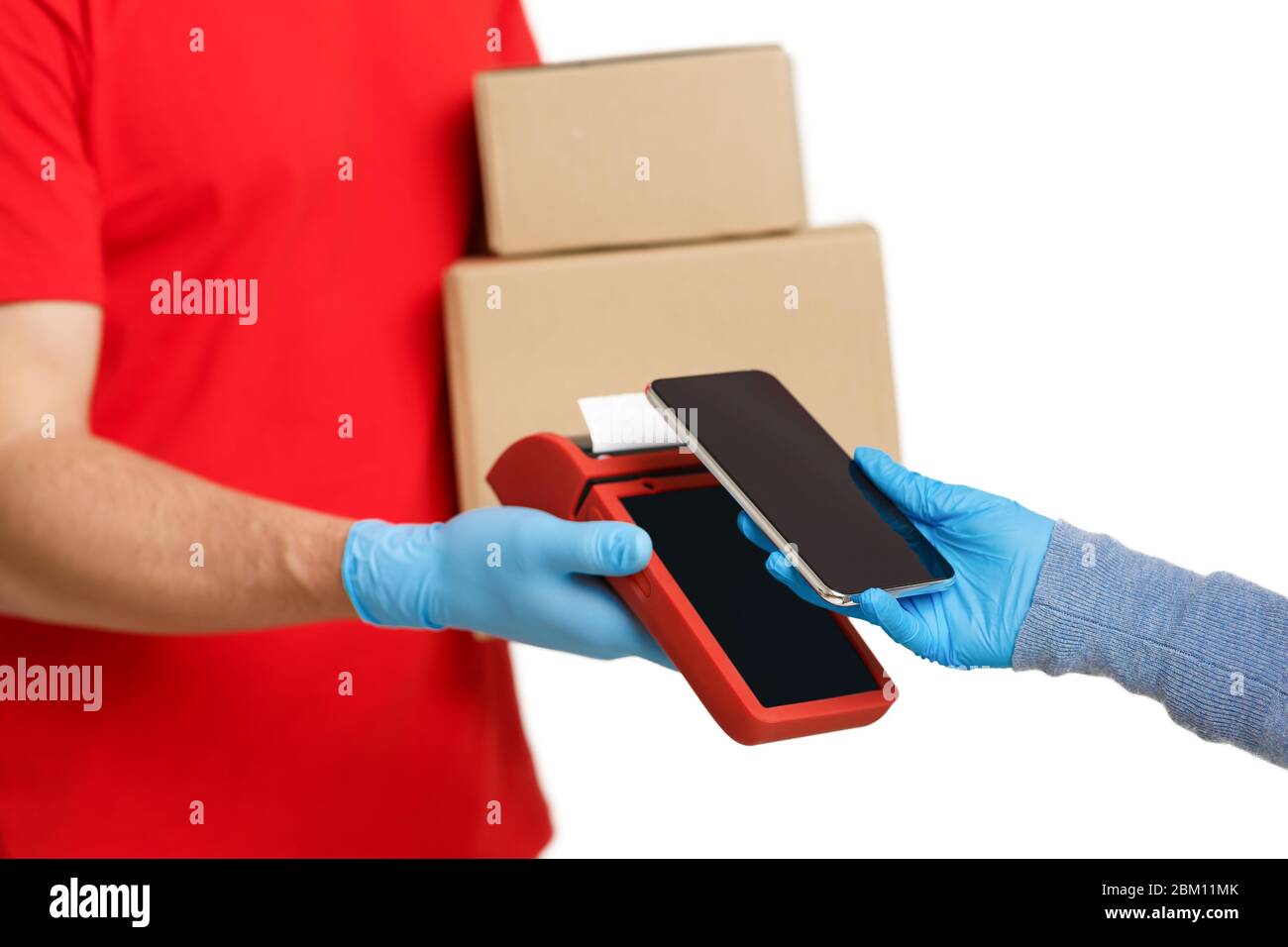 Customer pays for delivery using smartphone on contactless terminal ...