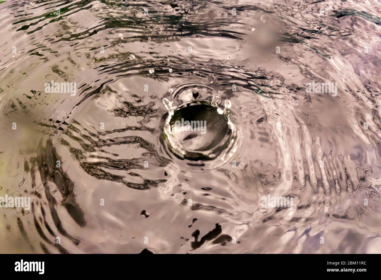 A single drop of water in a rain barrel Stock Photo - Alamy