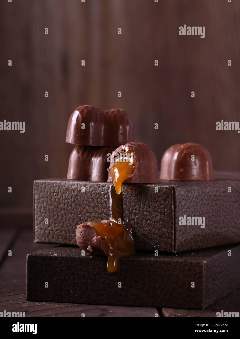 chocolate candies pralines with caramel Stock Photo - Alamy