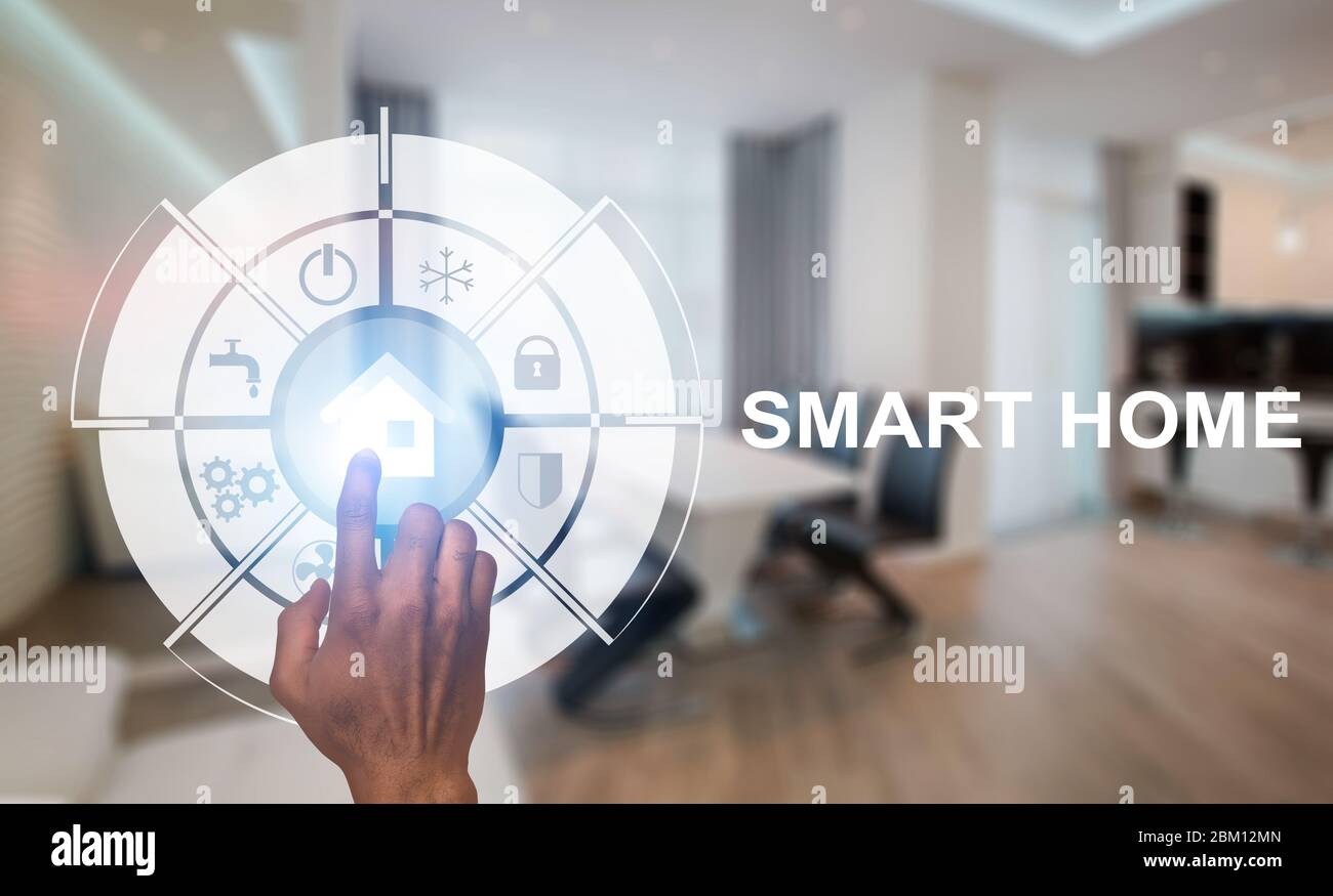 Closeup of young guy using smart home automation control system ...