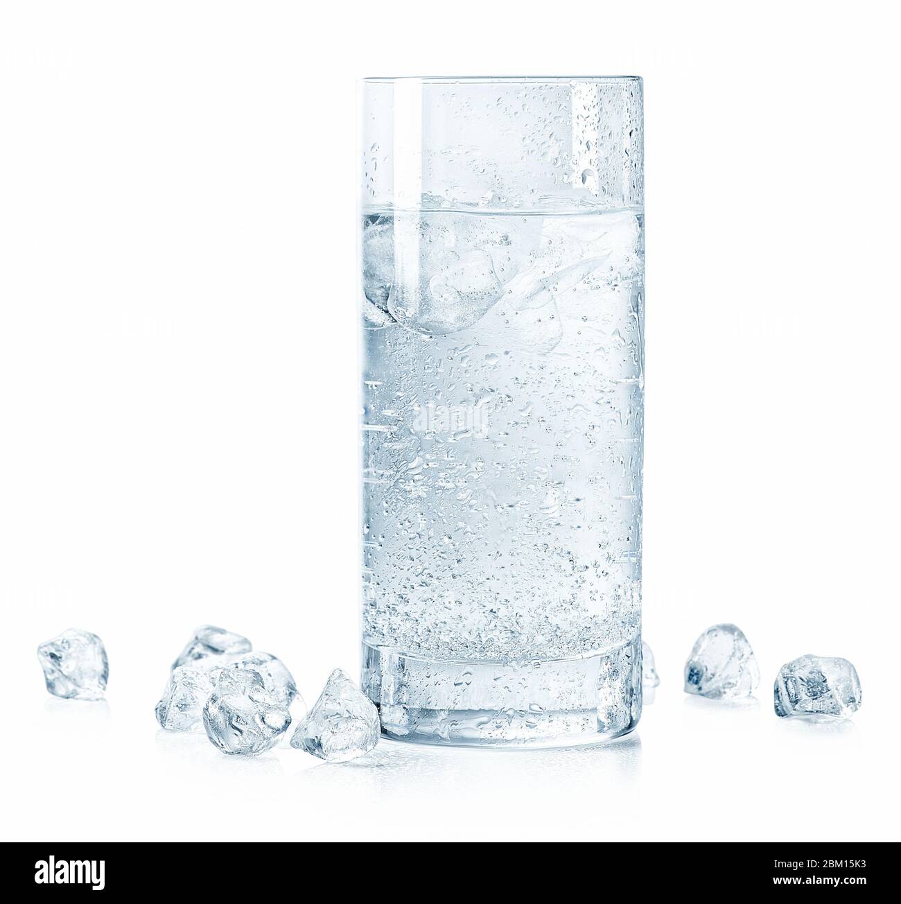 Glass of cold sparkling water and ice isolated on white background Stock Photo - Alamy