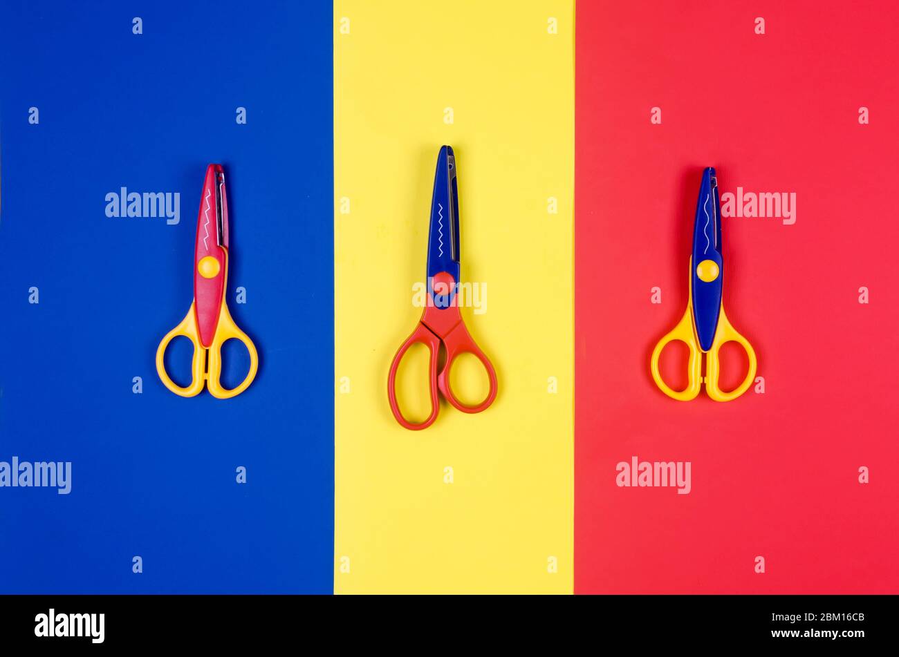 different scissors for children's creativity on colorful paper ...