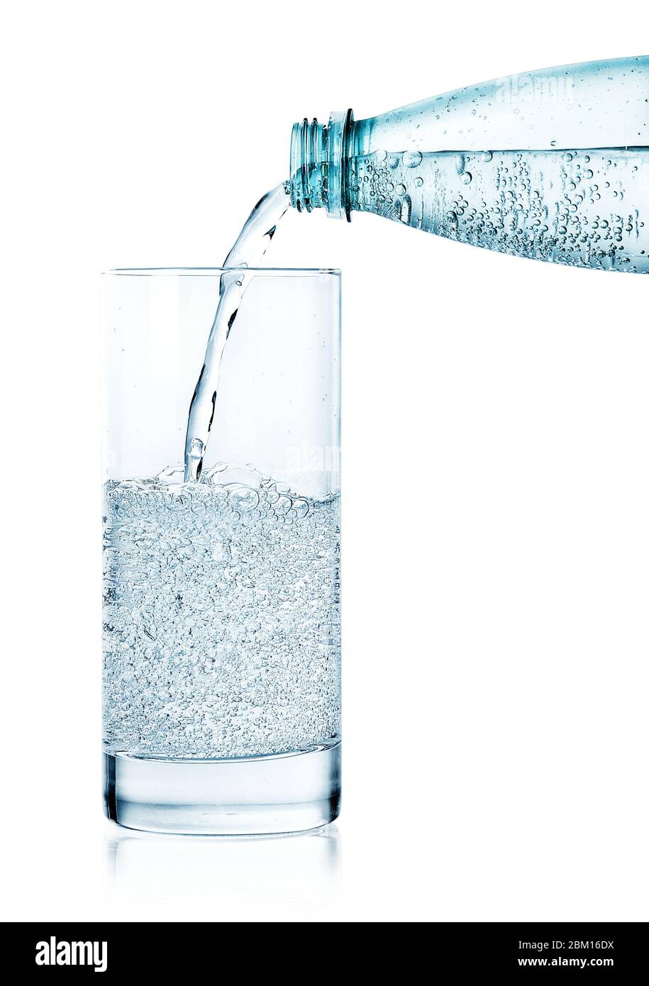 Pouring sparkling water in a glass isolated on white background Stock Photo - Alamy