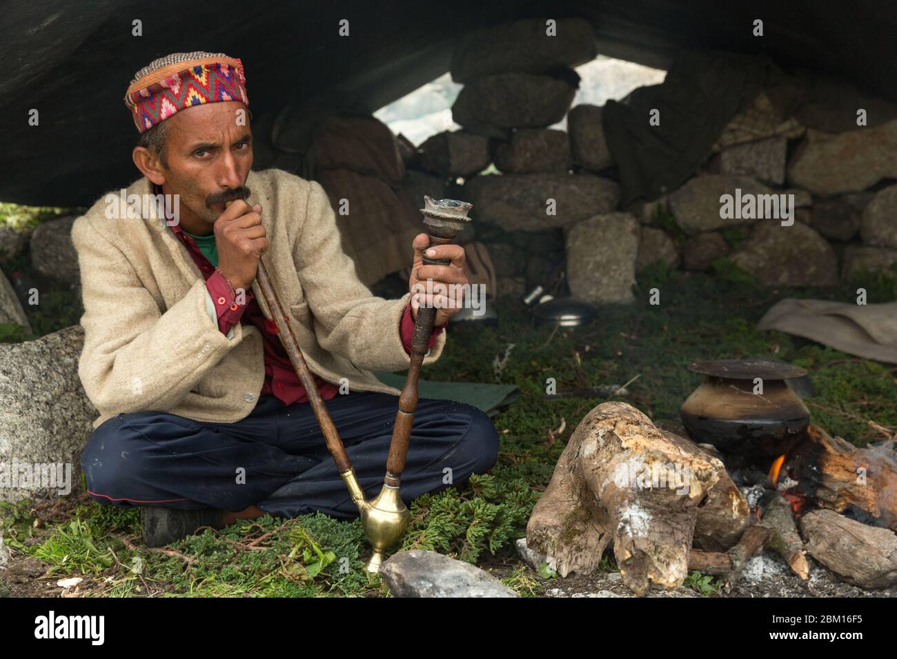 Native man from Himalayas preparing for hookah in north India, Himachal ...