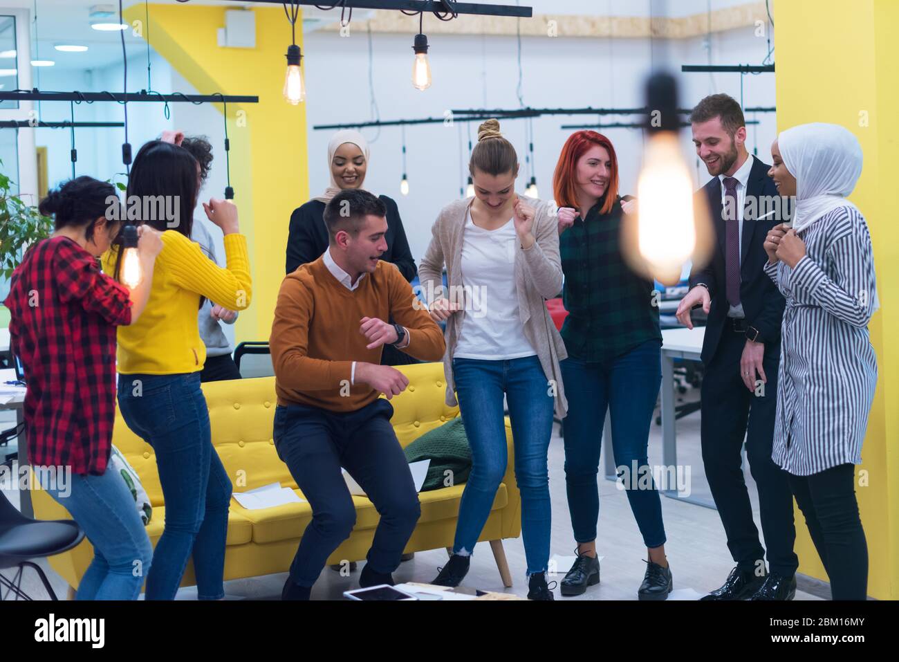 Young Business team celebrating a good job in the office. Group of ...