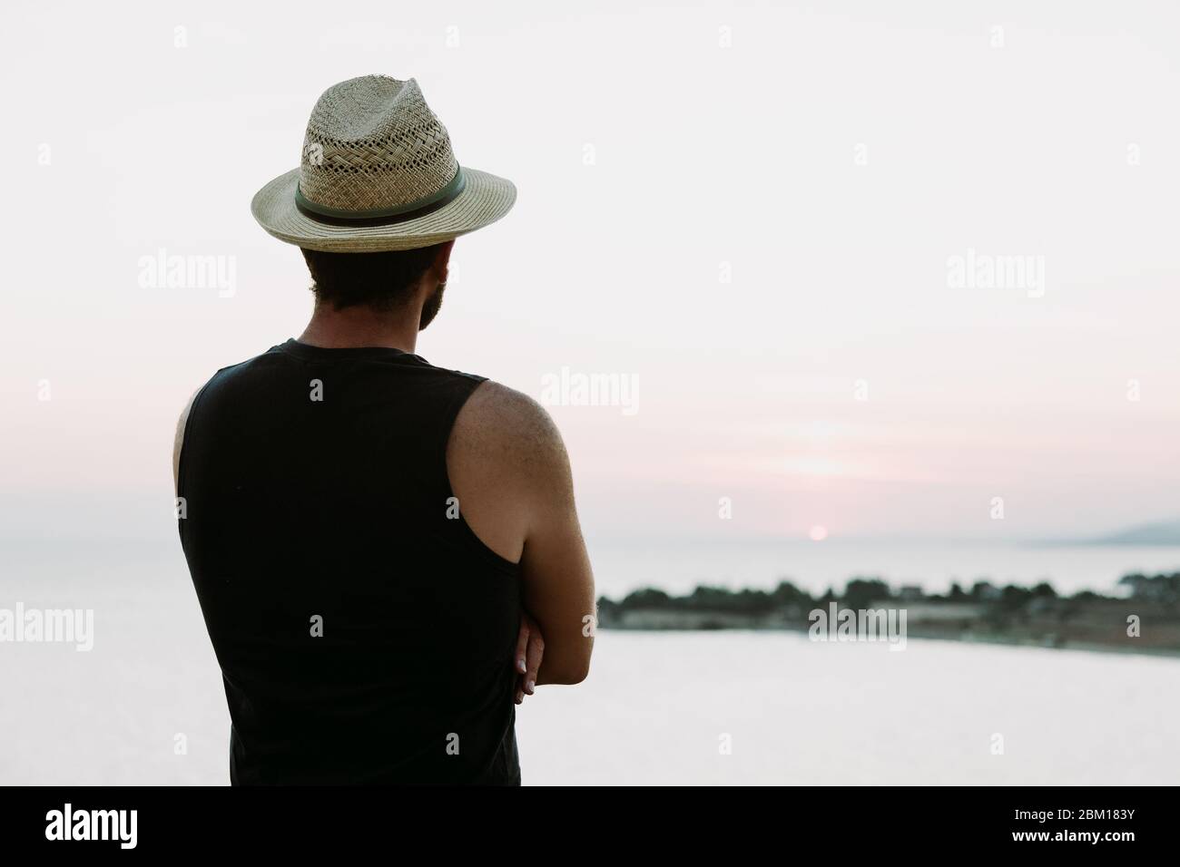 Young man at sunset hi-res stock photography and images - Alamy