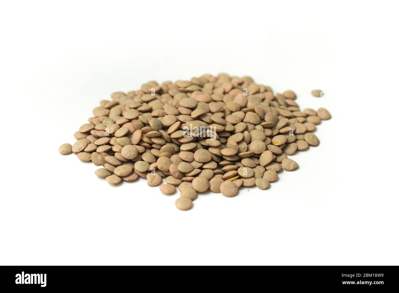 Pile of raw lentil isolated on white background Stock Photo - Alamy