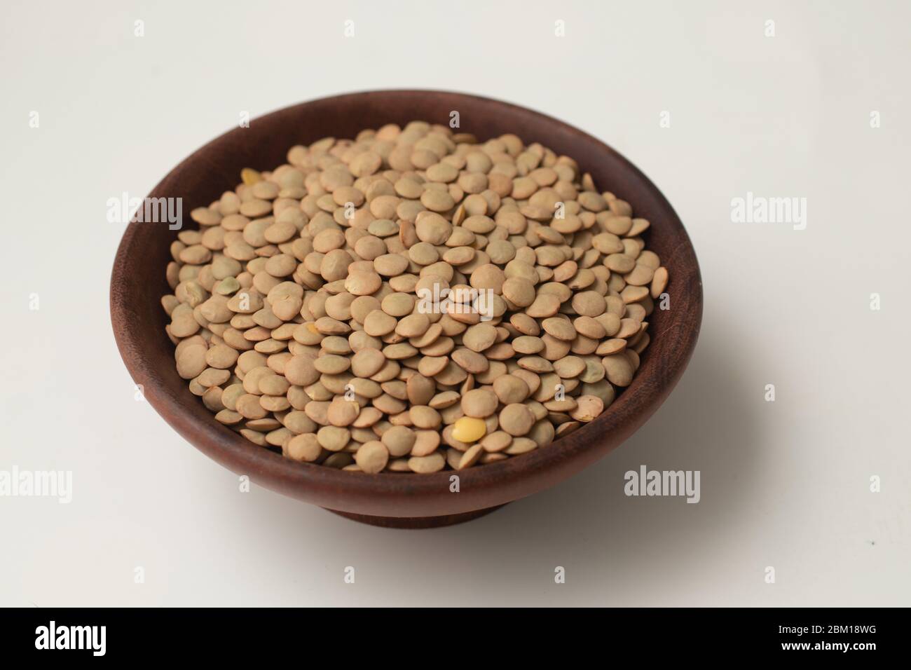 Pile of raw lentil in a bowl isolated Stock Photo - Alamy