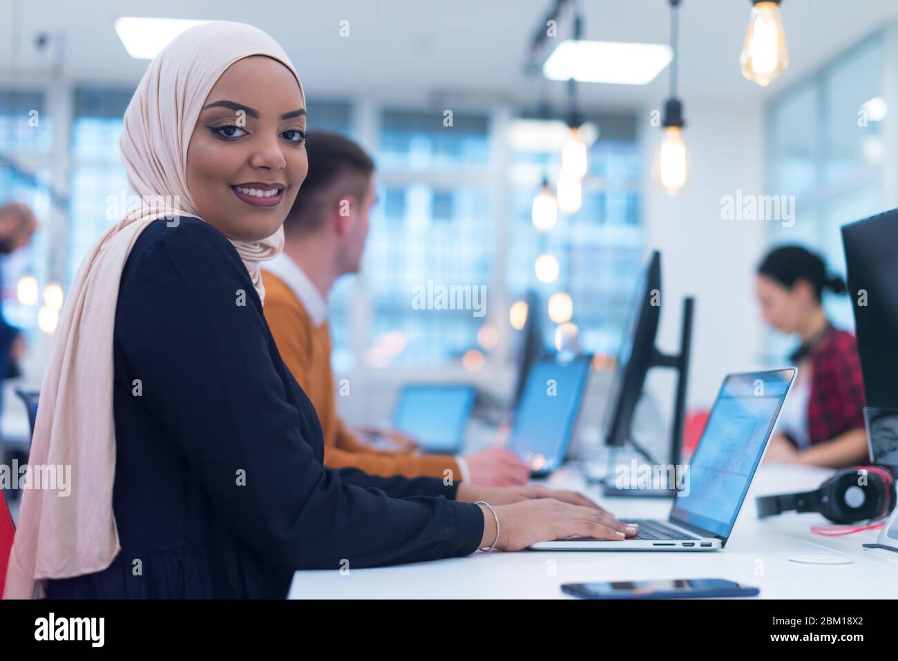 Young muslim African American business woman as a leader at work ...