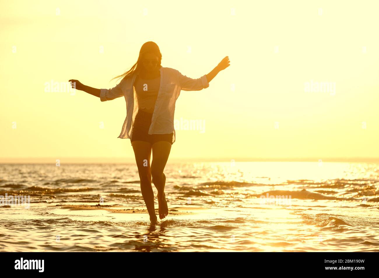 One happy woman walking in sunshine hi-res stock photography and images ...