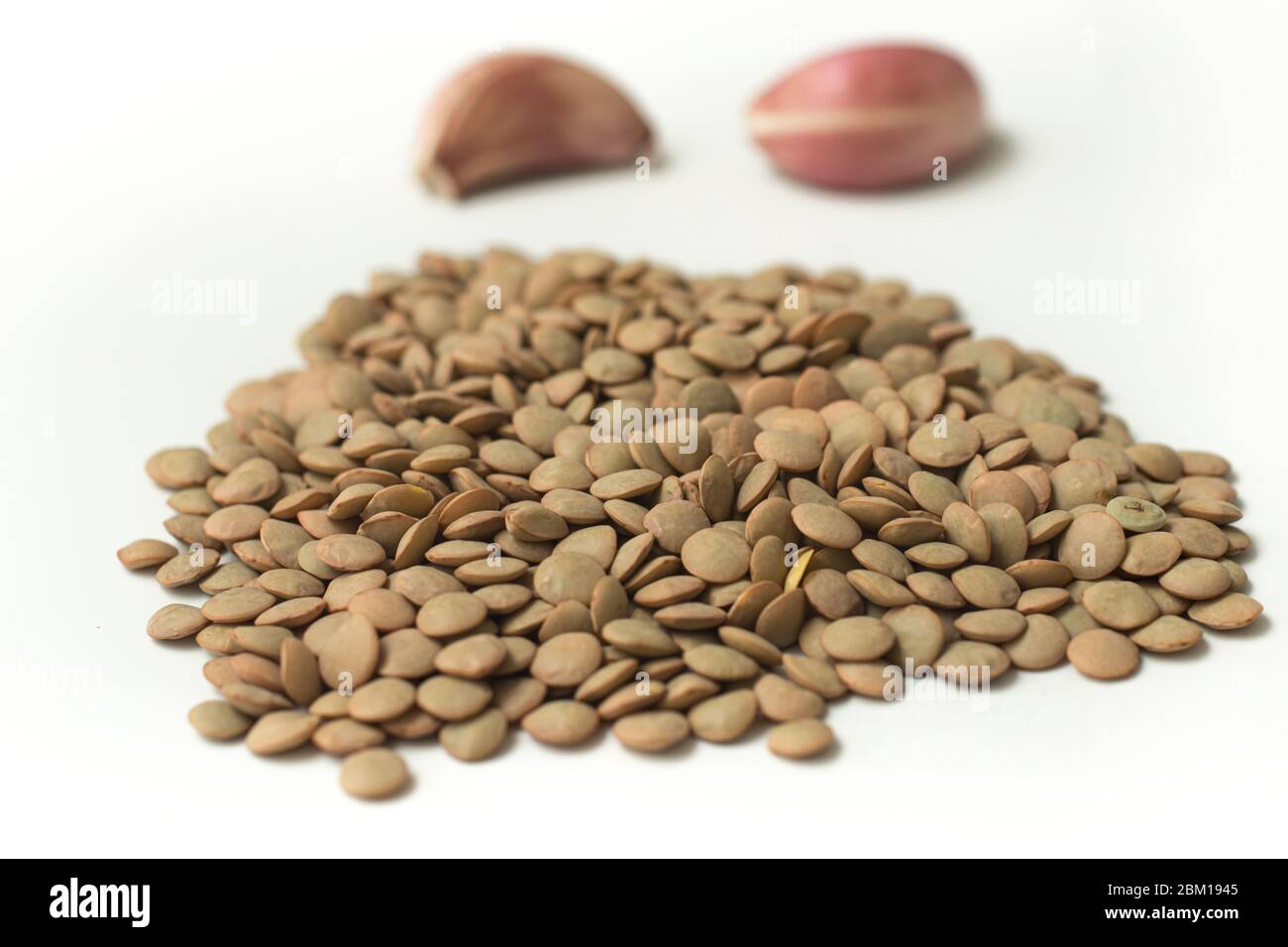 Pile of raw lentil isolated on white background Stock Photo - Alamy