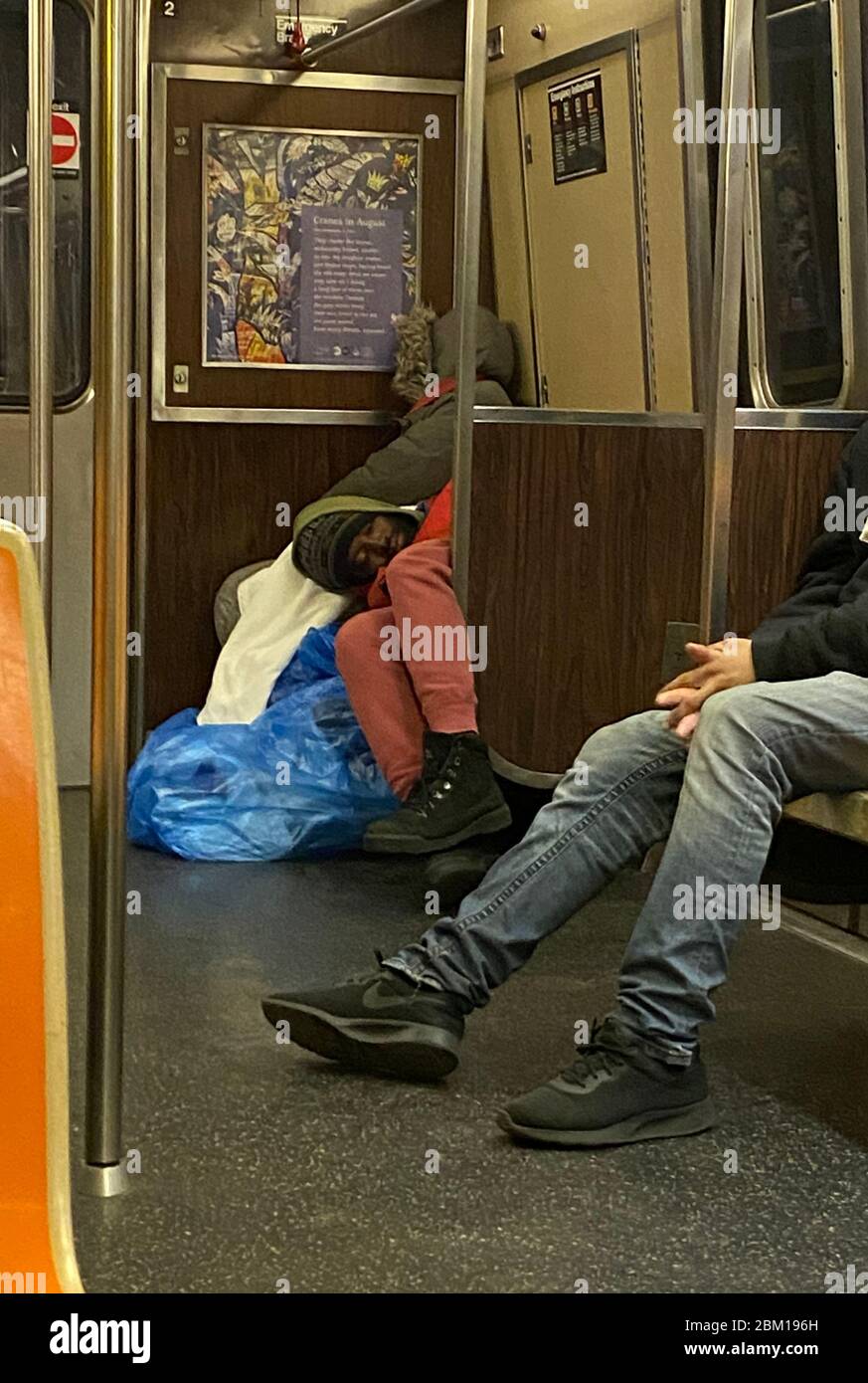 New York, NY, USA. 6th May, 2020. Homeless couple sleep on the subway ...