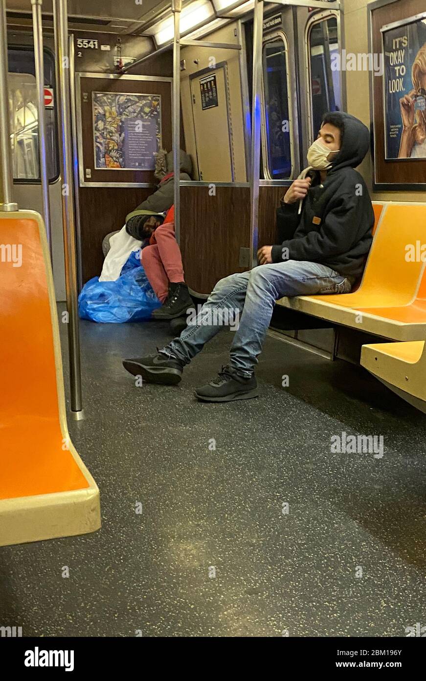 New York, NY, USA. 6th May, 2020. Homeless couple sleep on the subway ...