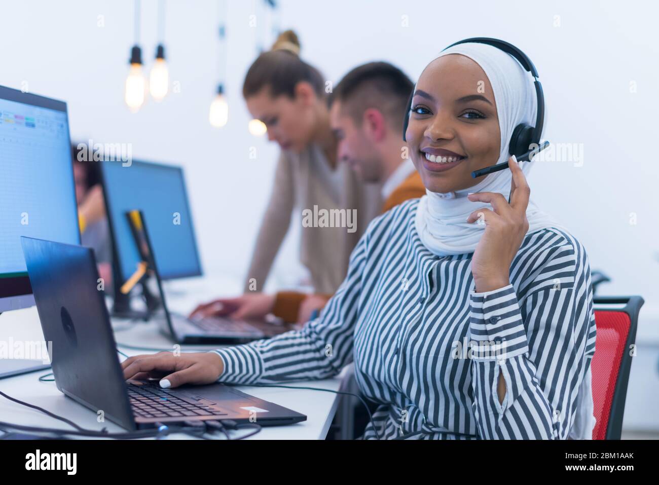 African muslim female with hijab scarf customer representative business ...