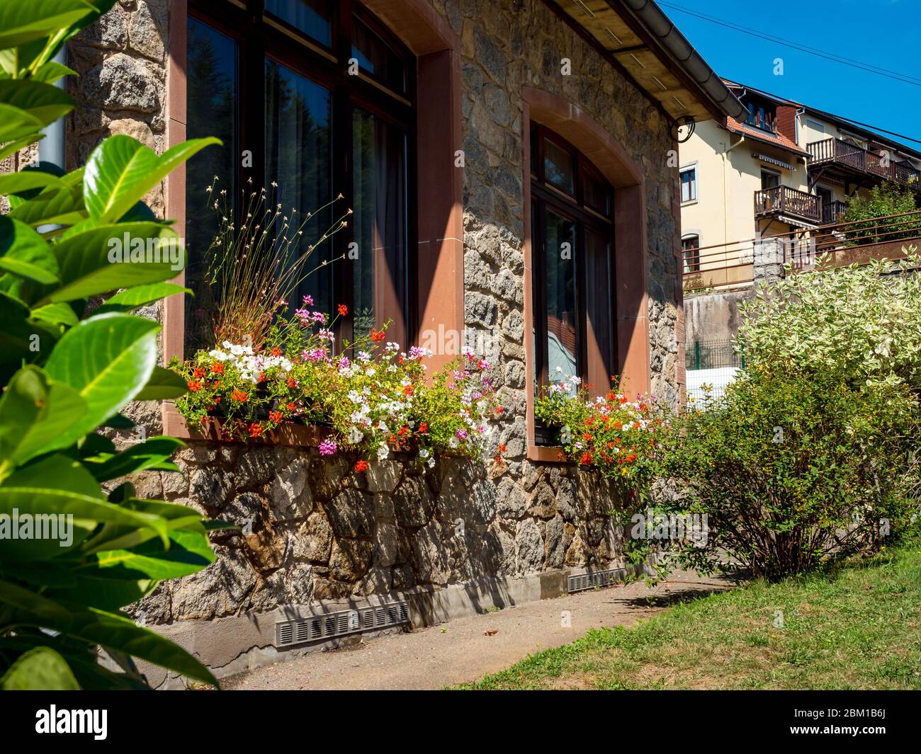 Flowering village in Alsace. Sunlit streets full of flowers. France ...