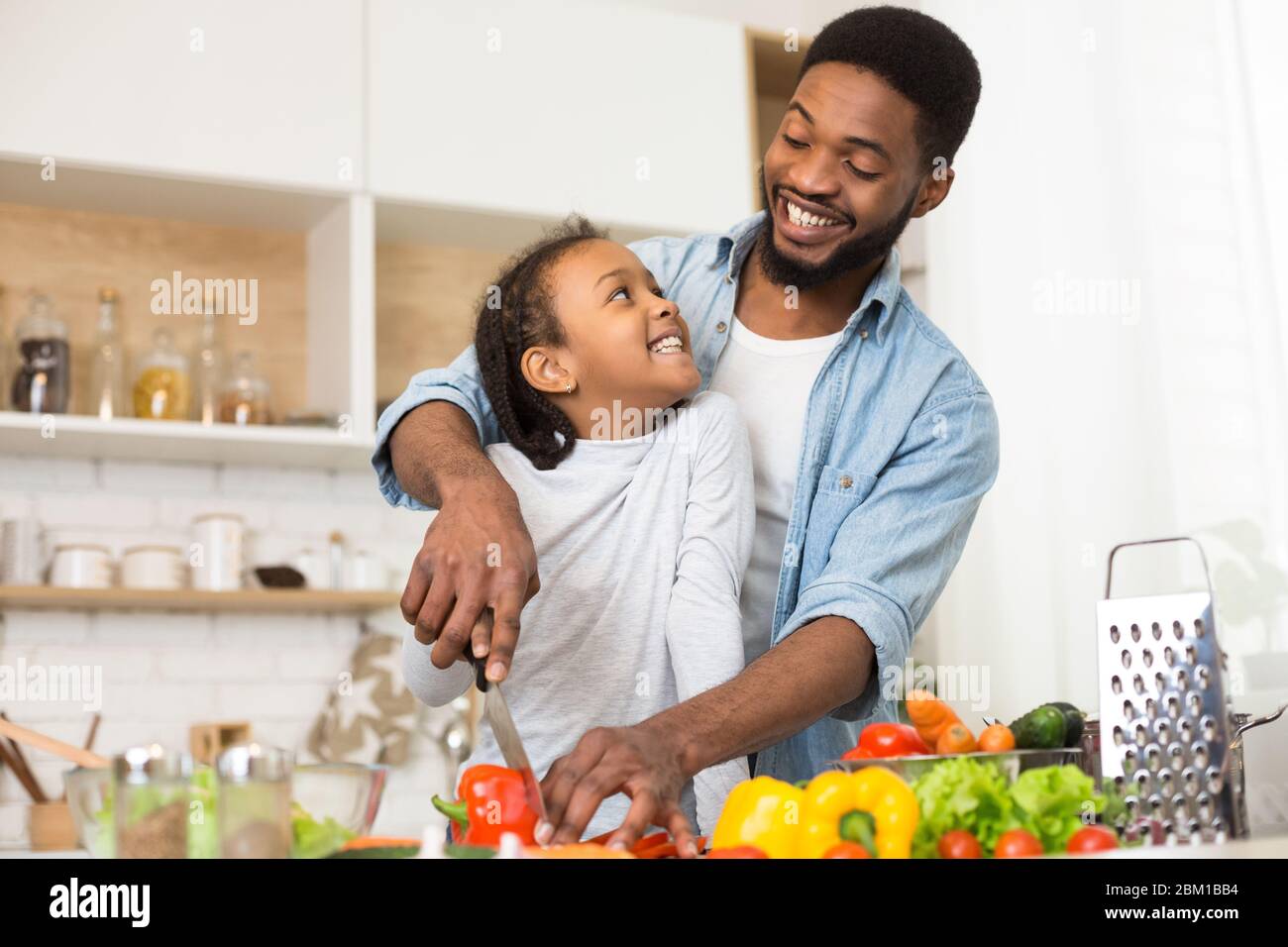 Daddy and daughter cooking together hi-res stock photography and images ...