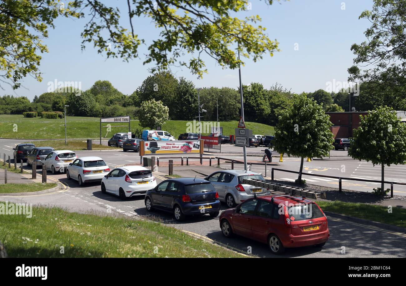 Drivers queue in their vehicles at a KFC restaurant in Basingstoke ...