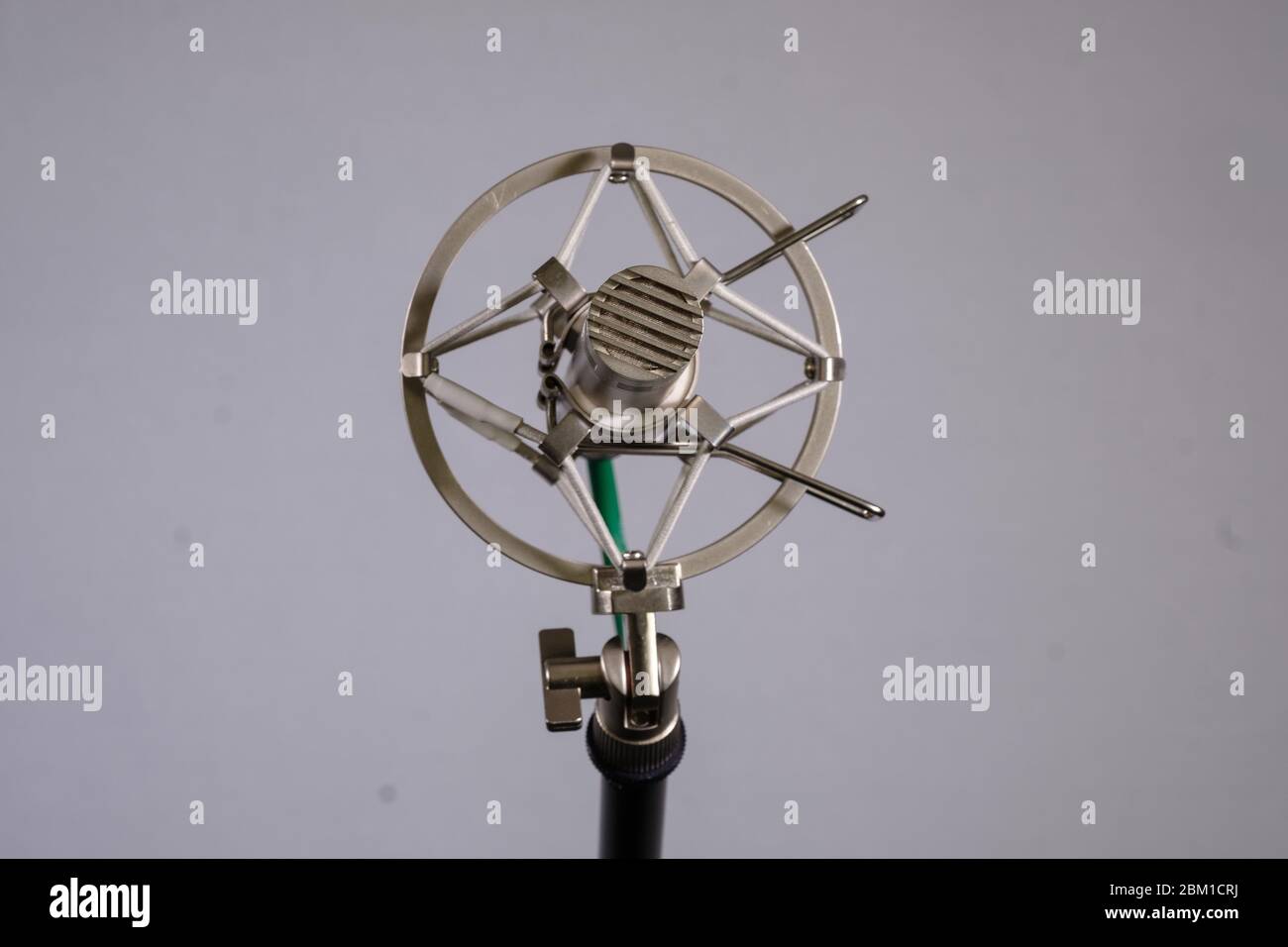 Small diaphragm condenser microphone in shock mount Stock Photo - Alamy