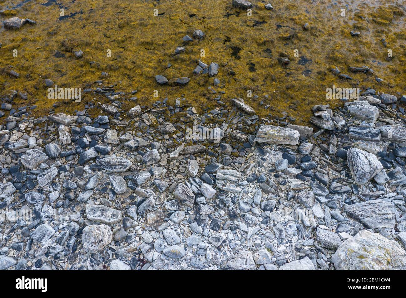 Aerial top view of sea waves hitting rocks on the beach Stock Photo - Alamy