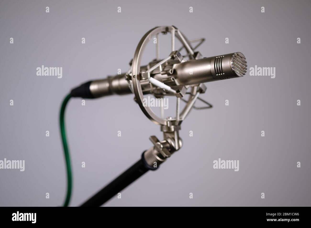 Small diaphragm condenser microphone in shock mount Stock Photo - Alamy