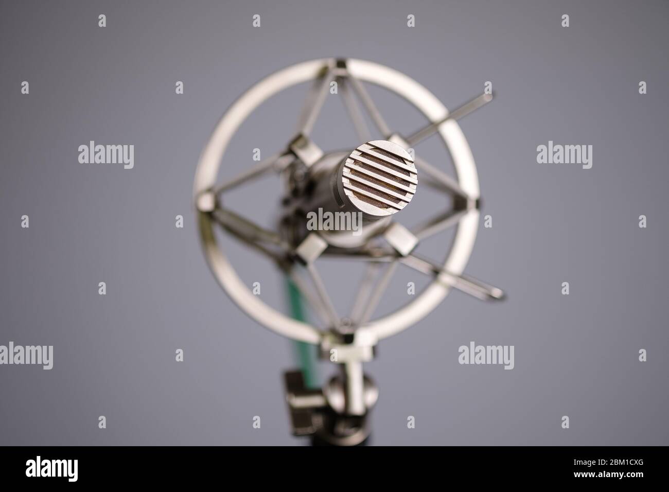 Small diaphragm condenser microphone in shock mount Stock Photo - Alamy