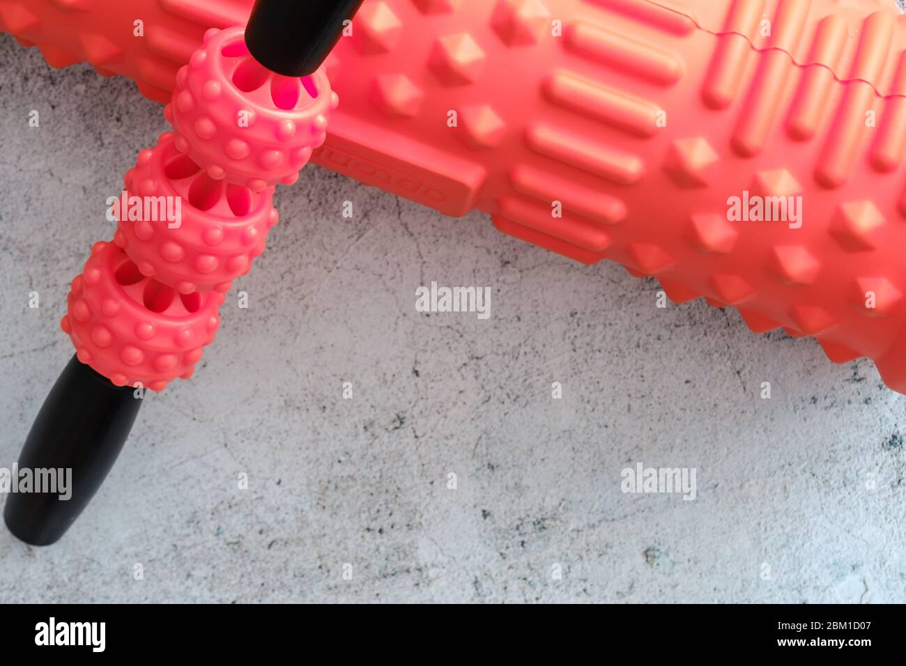 A orange color bumpy foam massage roller Stock Photo - Alamy