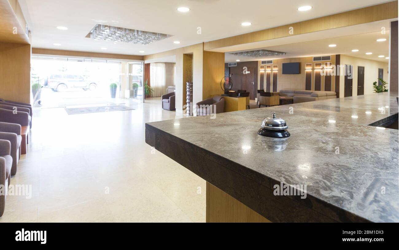Reception with classic bell. View of hotel entrance Stock Photo - Alamy