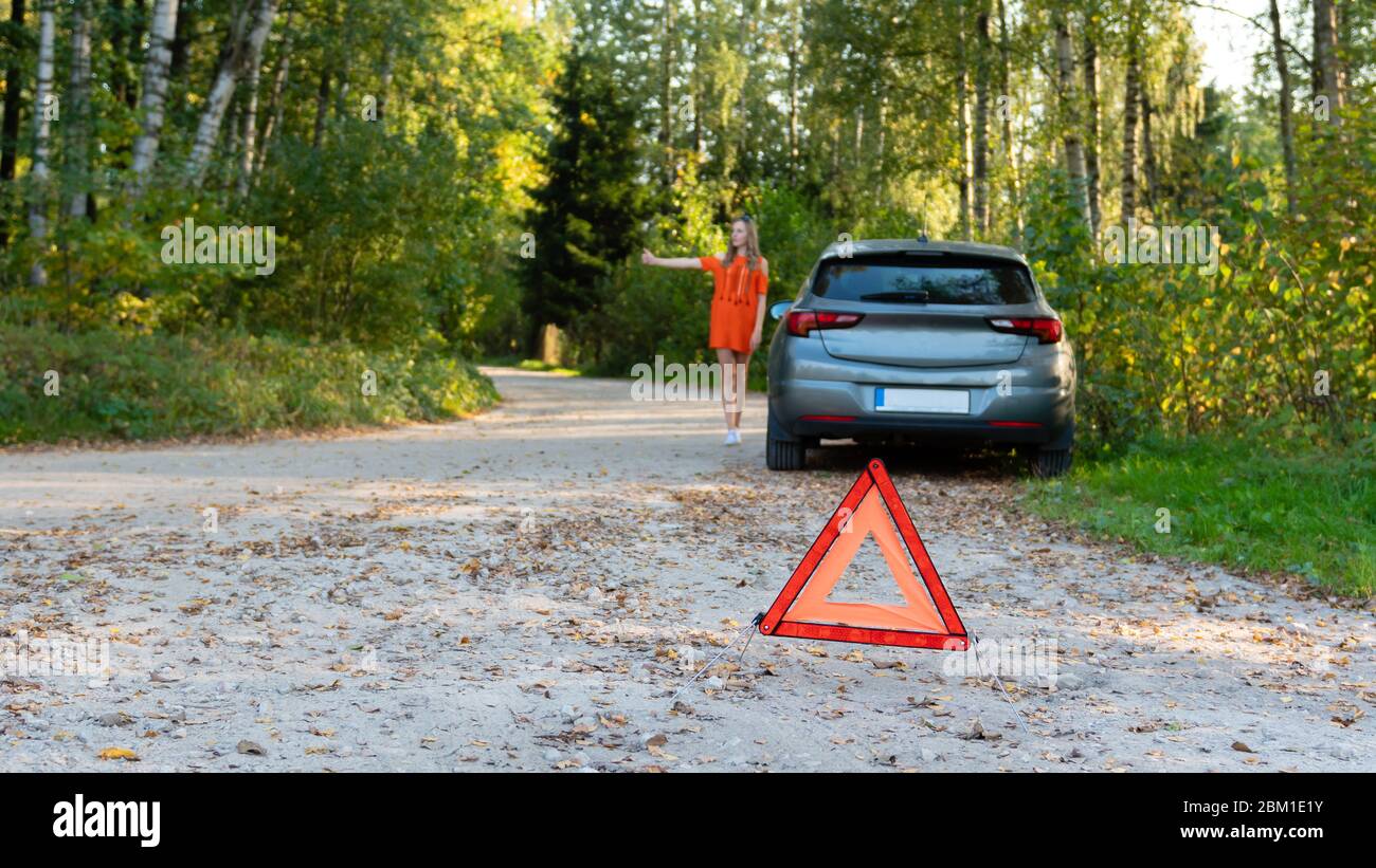 Red car stops hi-res stock photography and images - Alamy