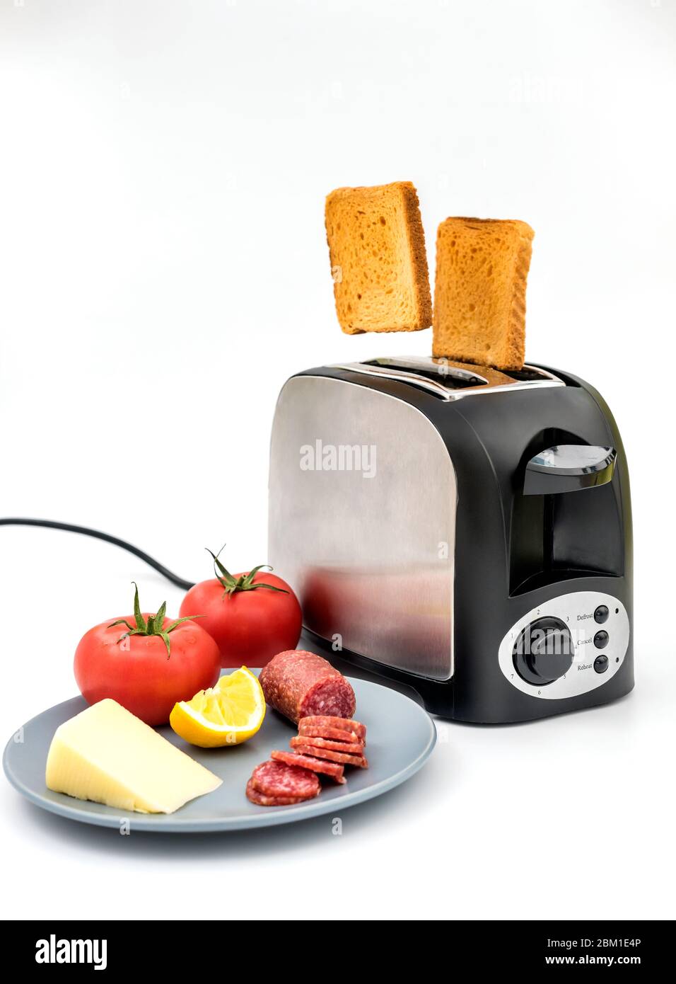 Toasts jumping out of retro style black and metallic toaster on white ...