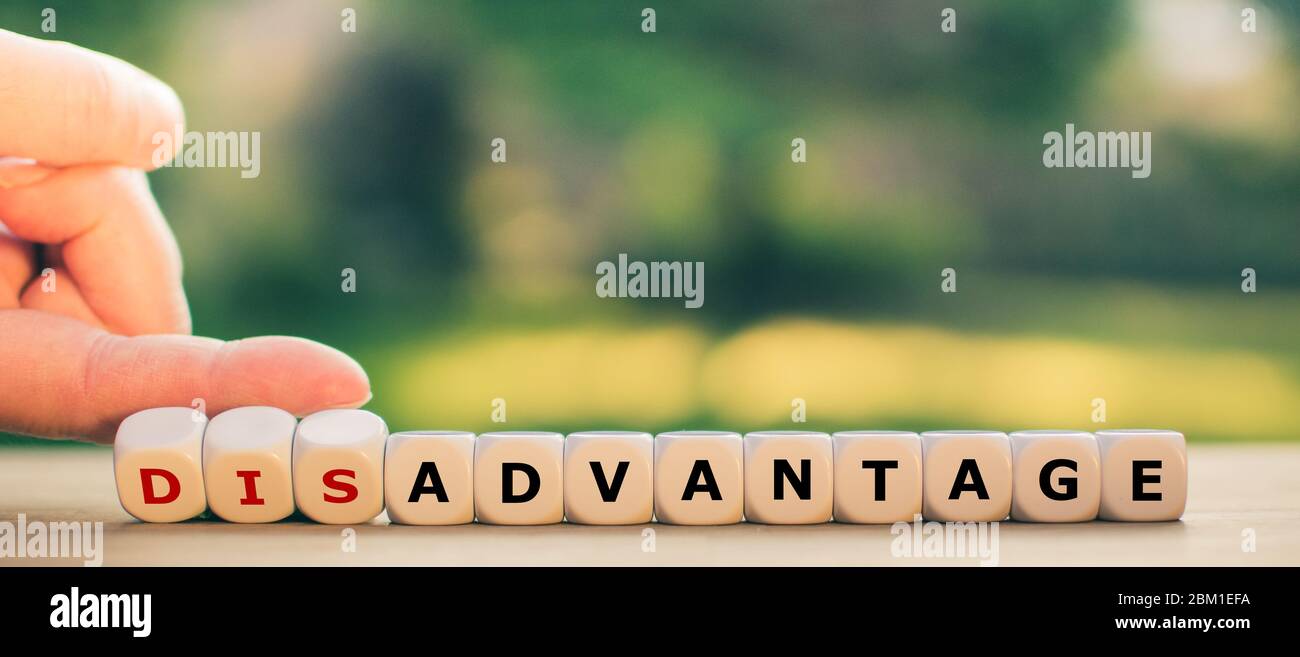 Hand turns dice and changes the word "disadvantage" to "advantage Stock ...