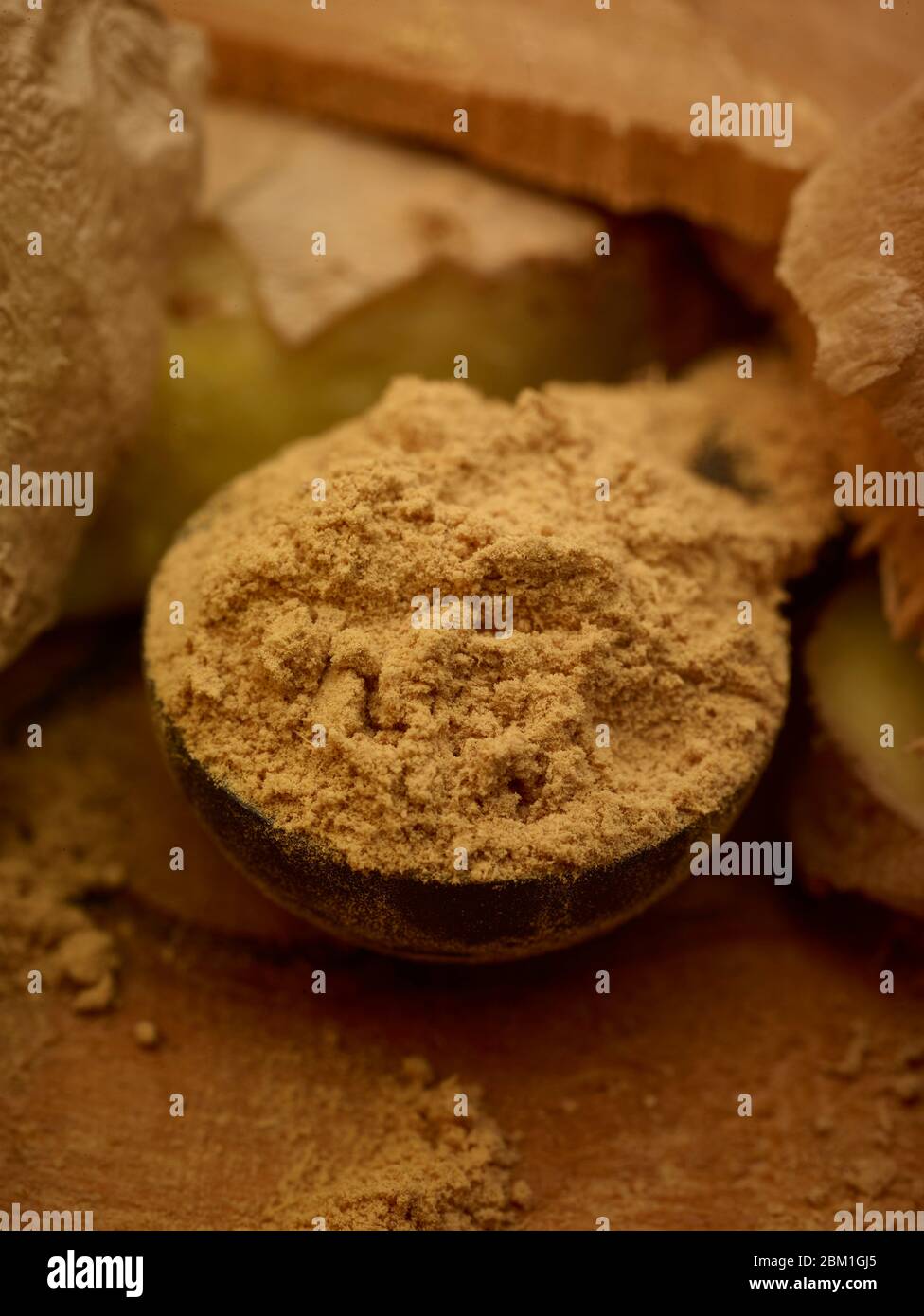 Close-up still life of ground ginger in measuring spoon, food ...