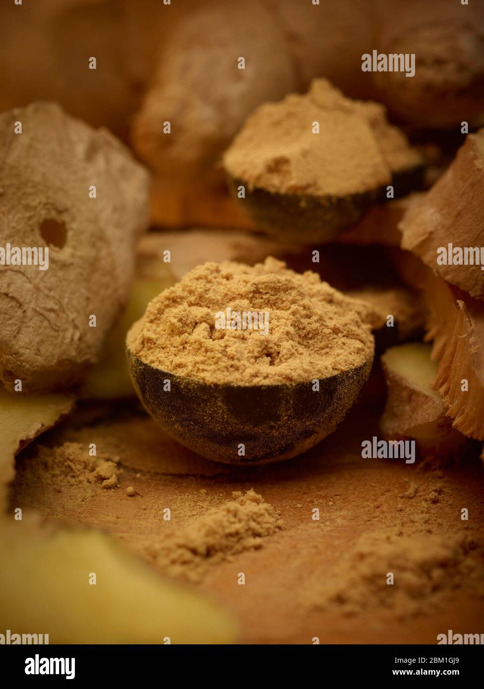 Close-up still life of ground ginger in measuring spoon, food ...