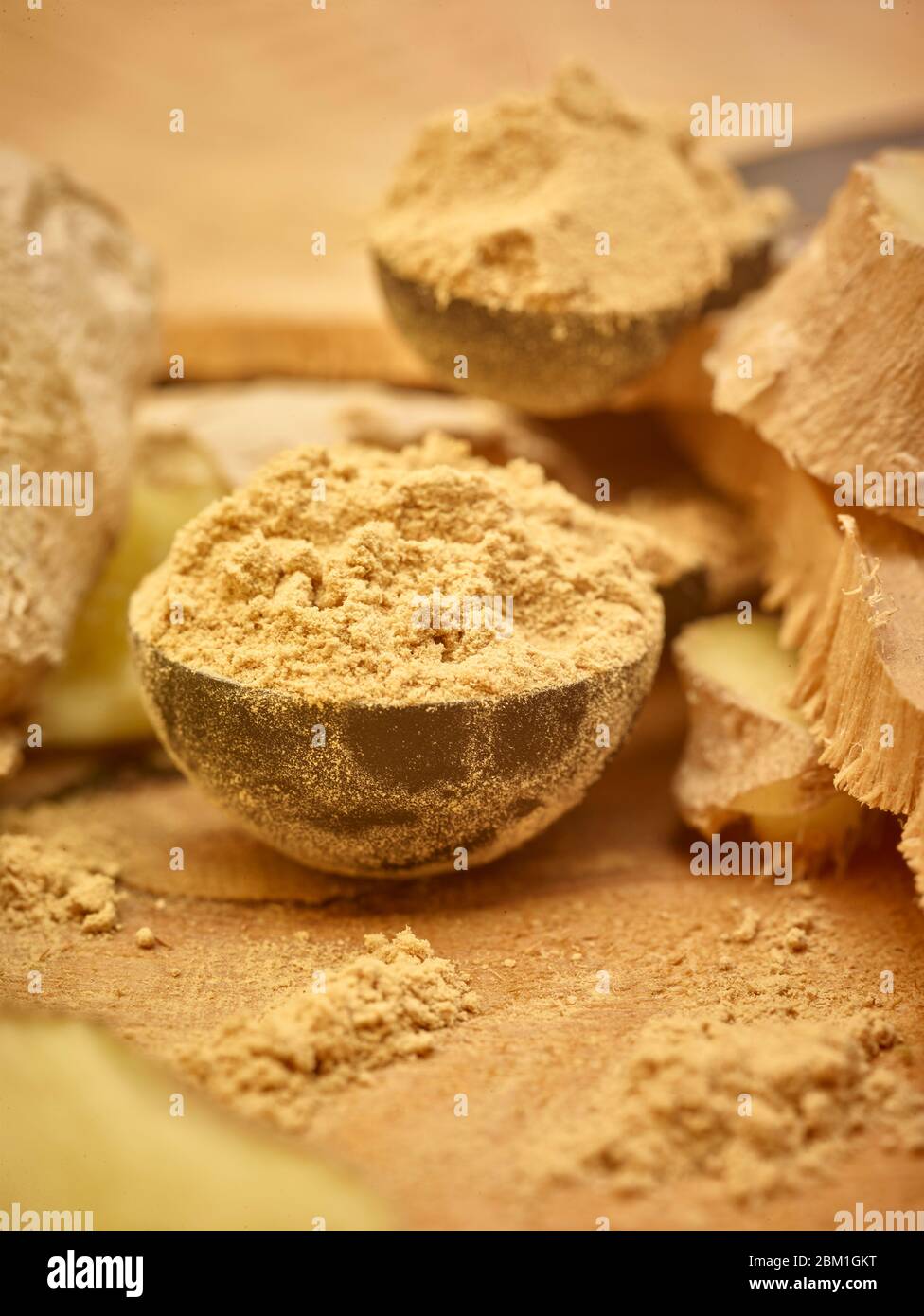 Close-up food still-life portrait of ground ginger in measuring spoon ...