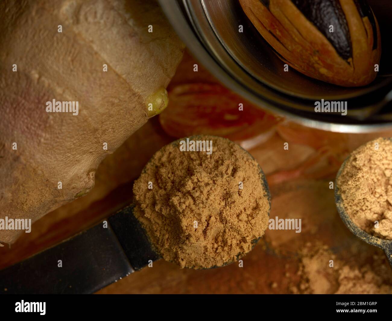 Close-up still life of ground ginger in measuring spoon, food ...