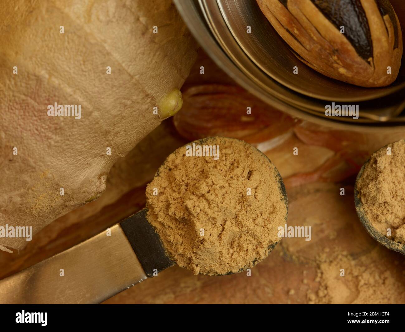 Close-up still life of ground ginger in measuring spoon, food ...