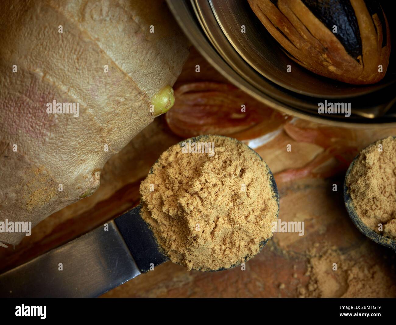 Close-up still life of ground ginger in measuring spoon, food ...